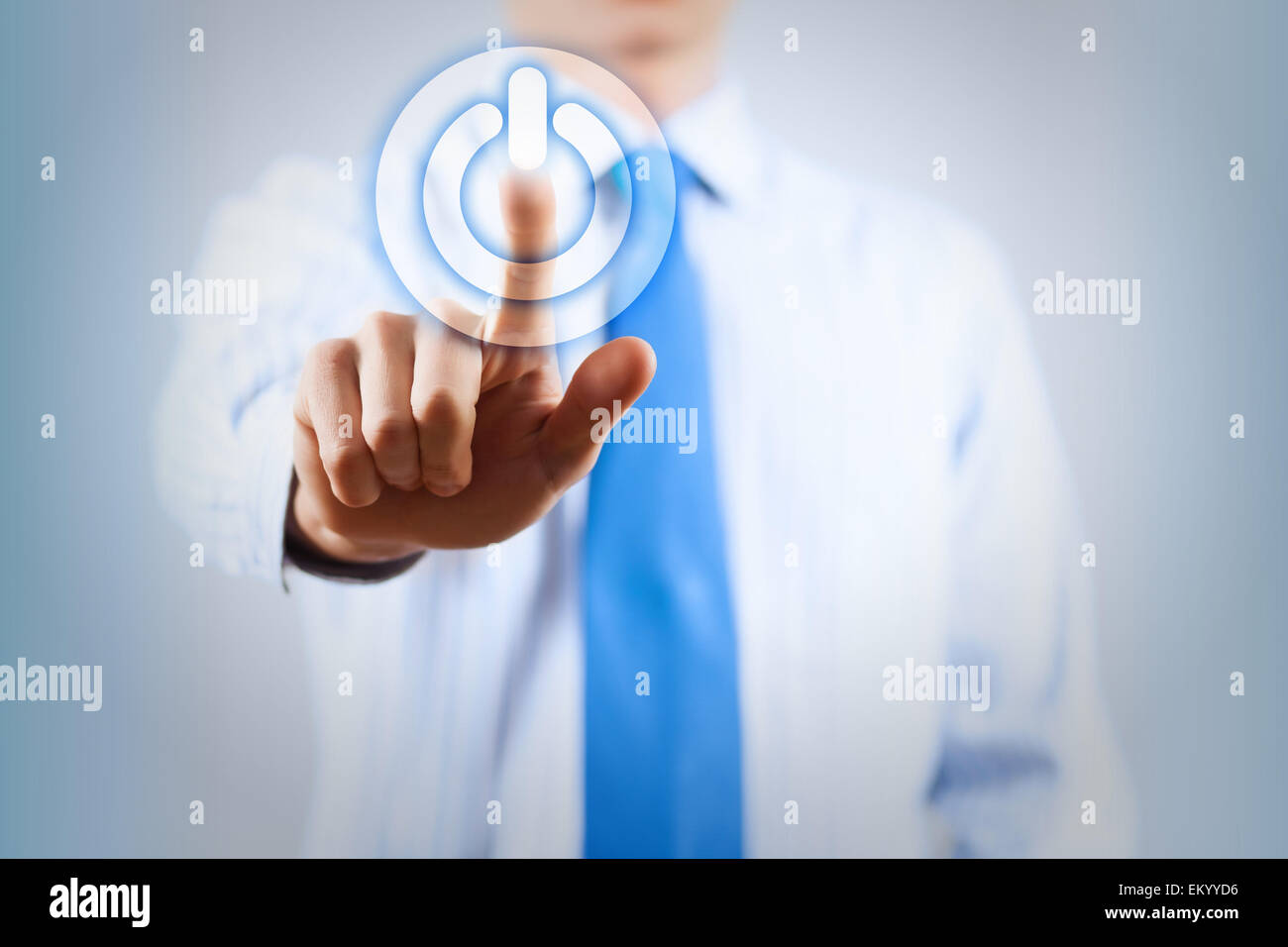 Young man press the power button Stock Photo - Alamy