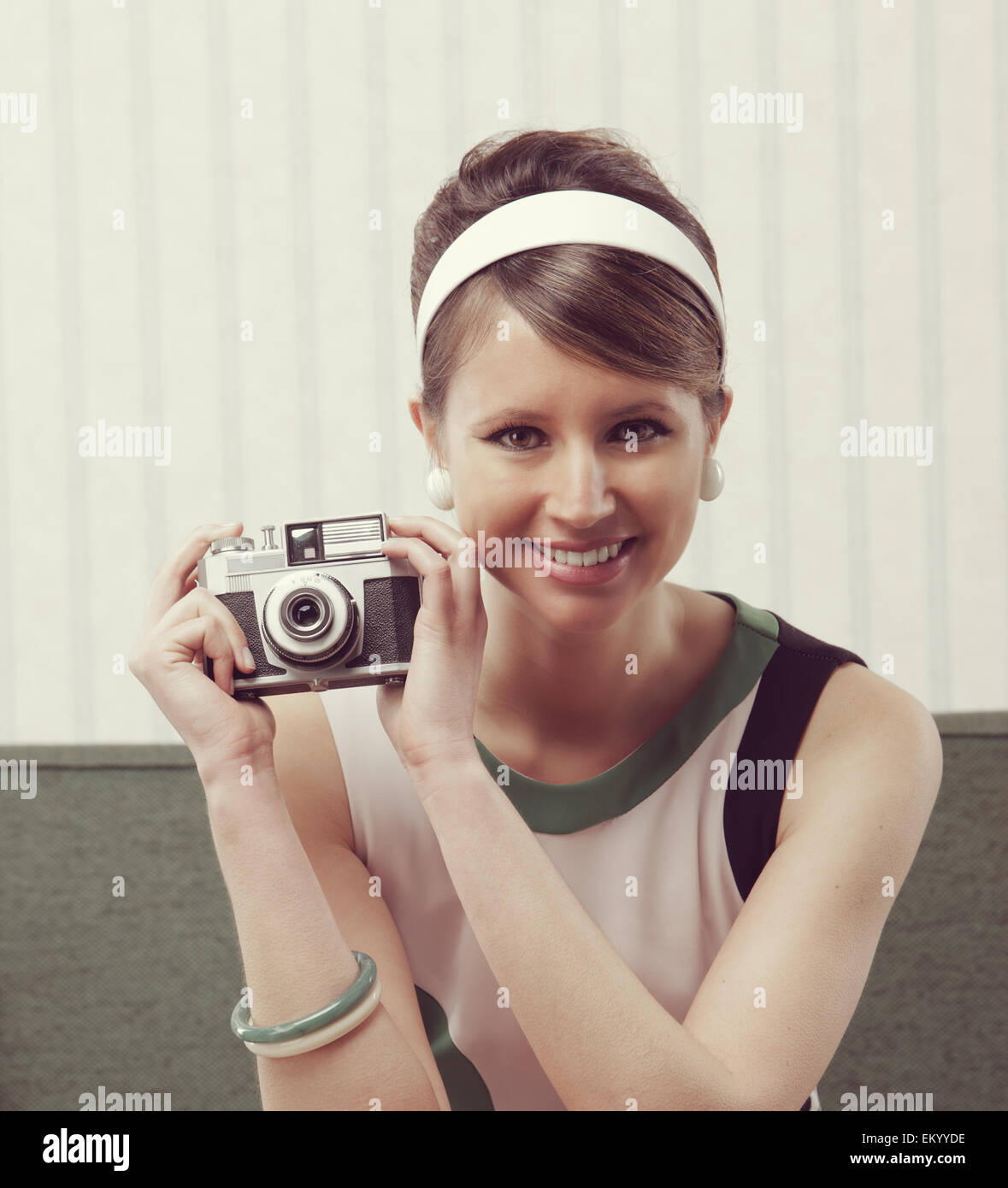 Retro woman with old-fashioned camera Stock Photo - Alamy