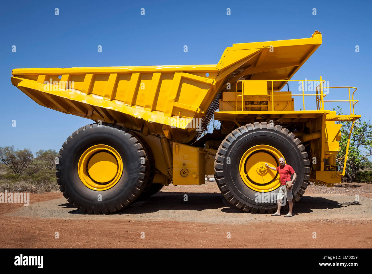 big yellow transporter Stock Photo - Alamy