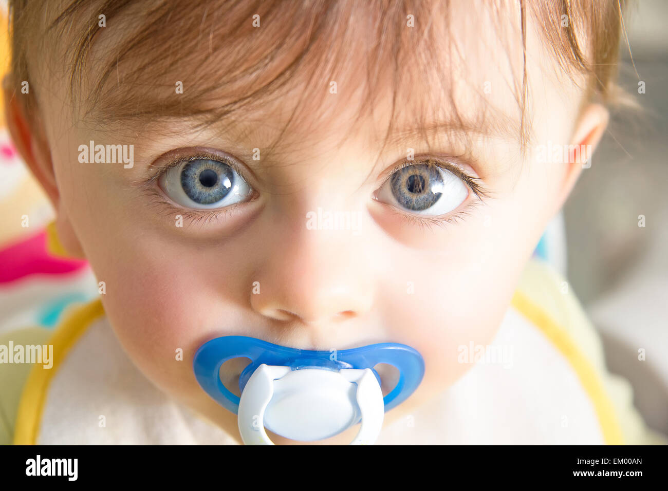 Baby with pacifier Stock Photo - Alamy