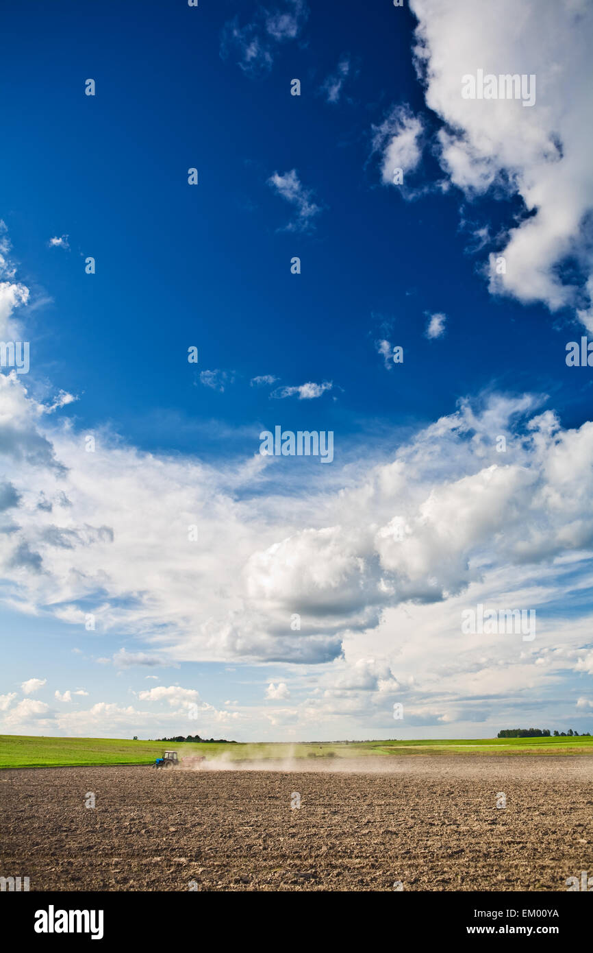 Tractor on a field Stock Photo - Alamy