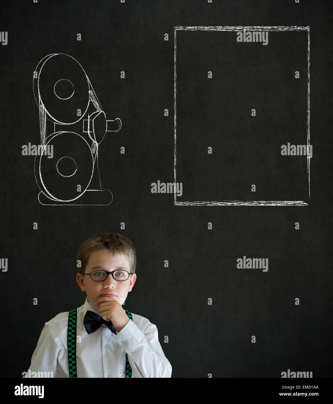 Thinking boy business man with retro chalk film projector Stock Photo ...