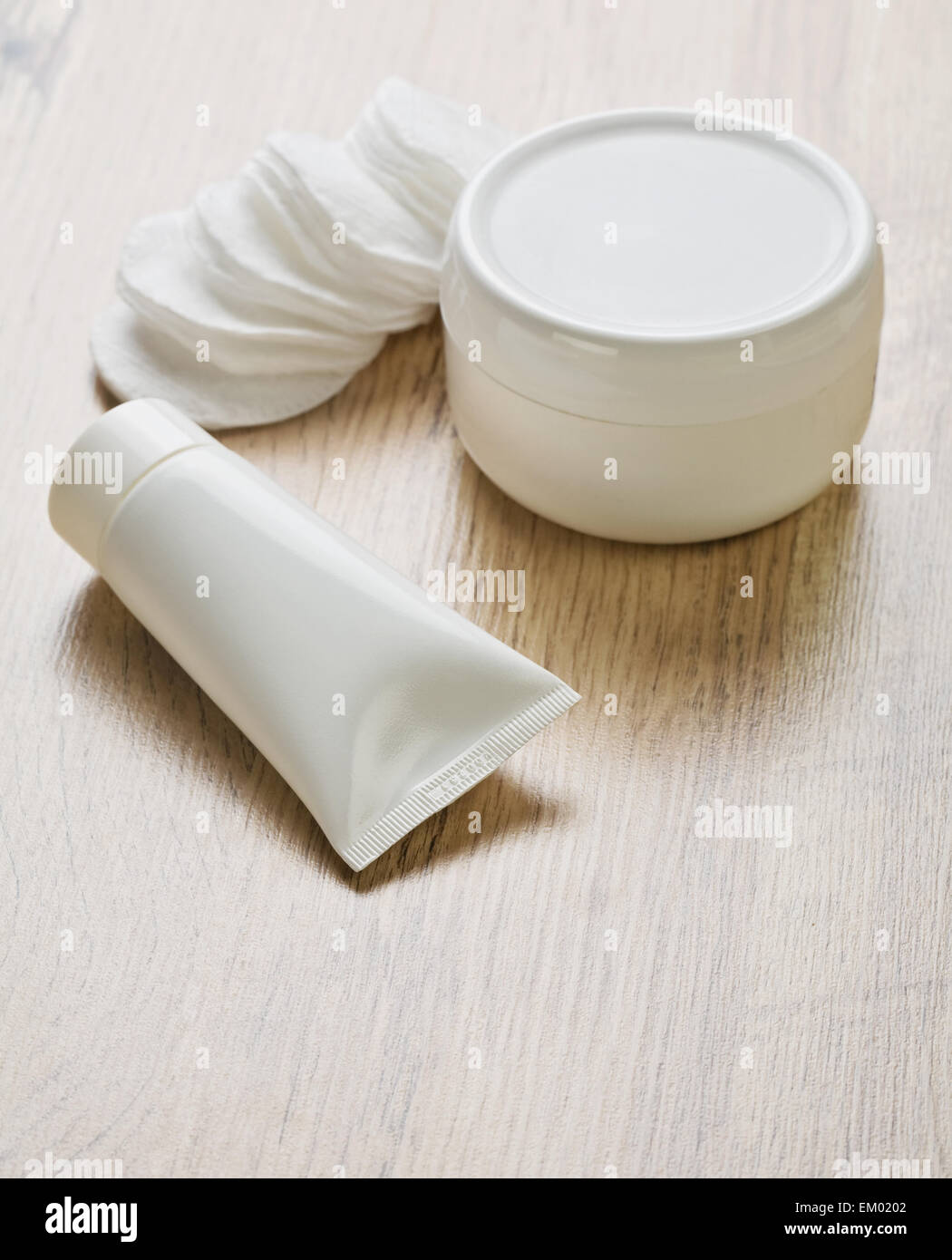 white objects on wooden background Stock Photo - Alamy