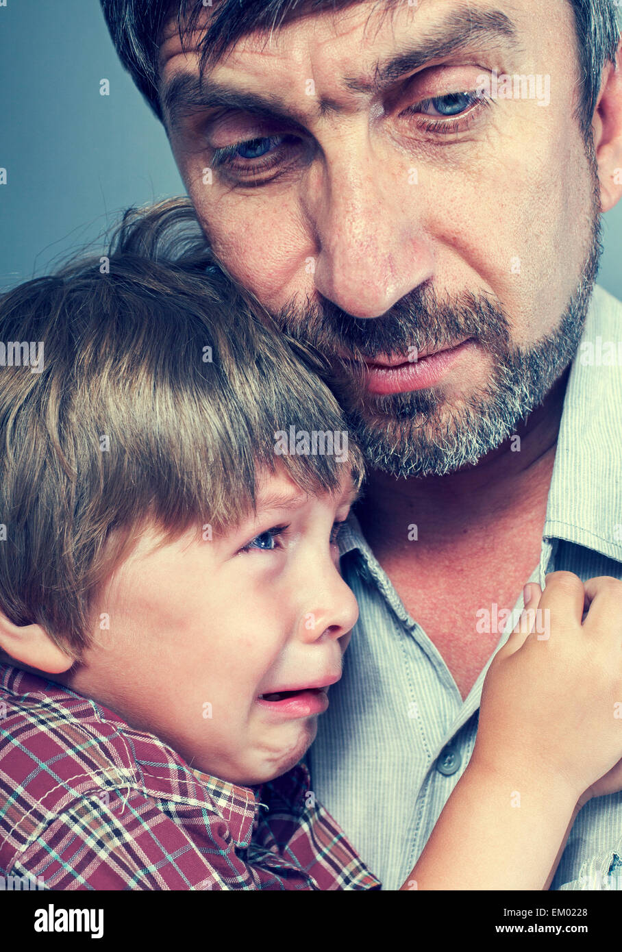 father pities his son Stock Photo - Alamy