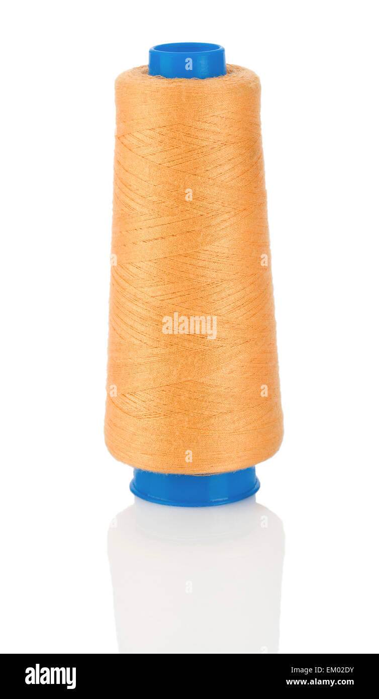 orange thread on blue Spool Stock Photo - Alamy