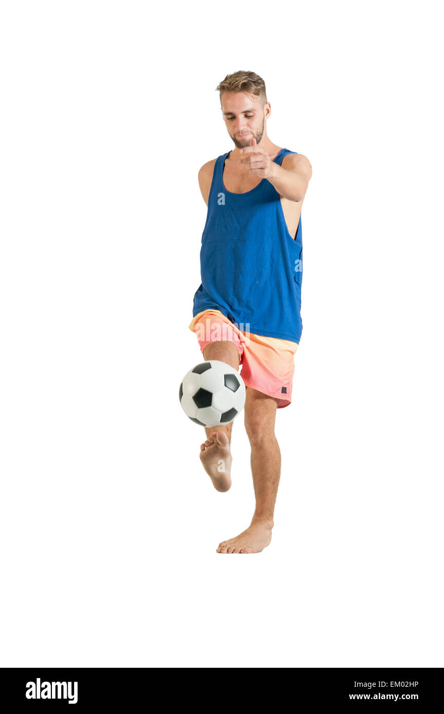 Young attractive guy playing with football on white background Stock ...