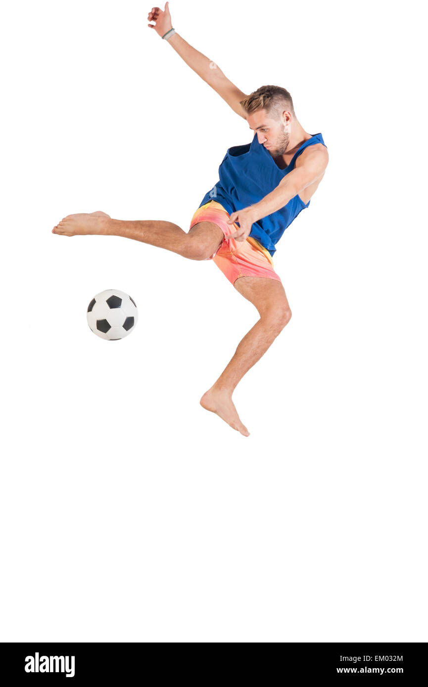 Young attractive guy playing with football on white background Stock ...