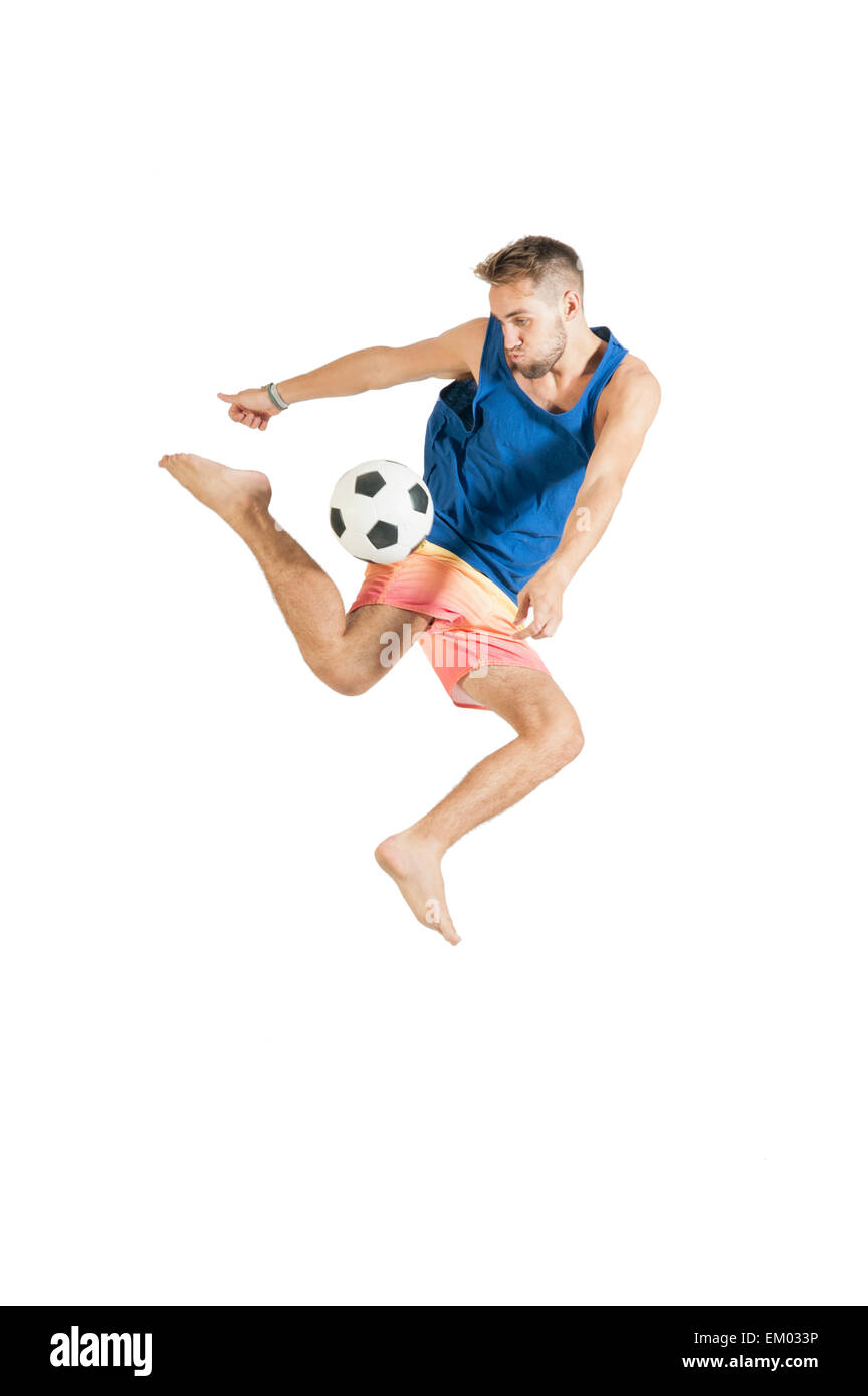 Young attractive guy playing with football on white background Stock ...