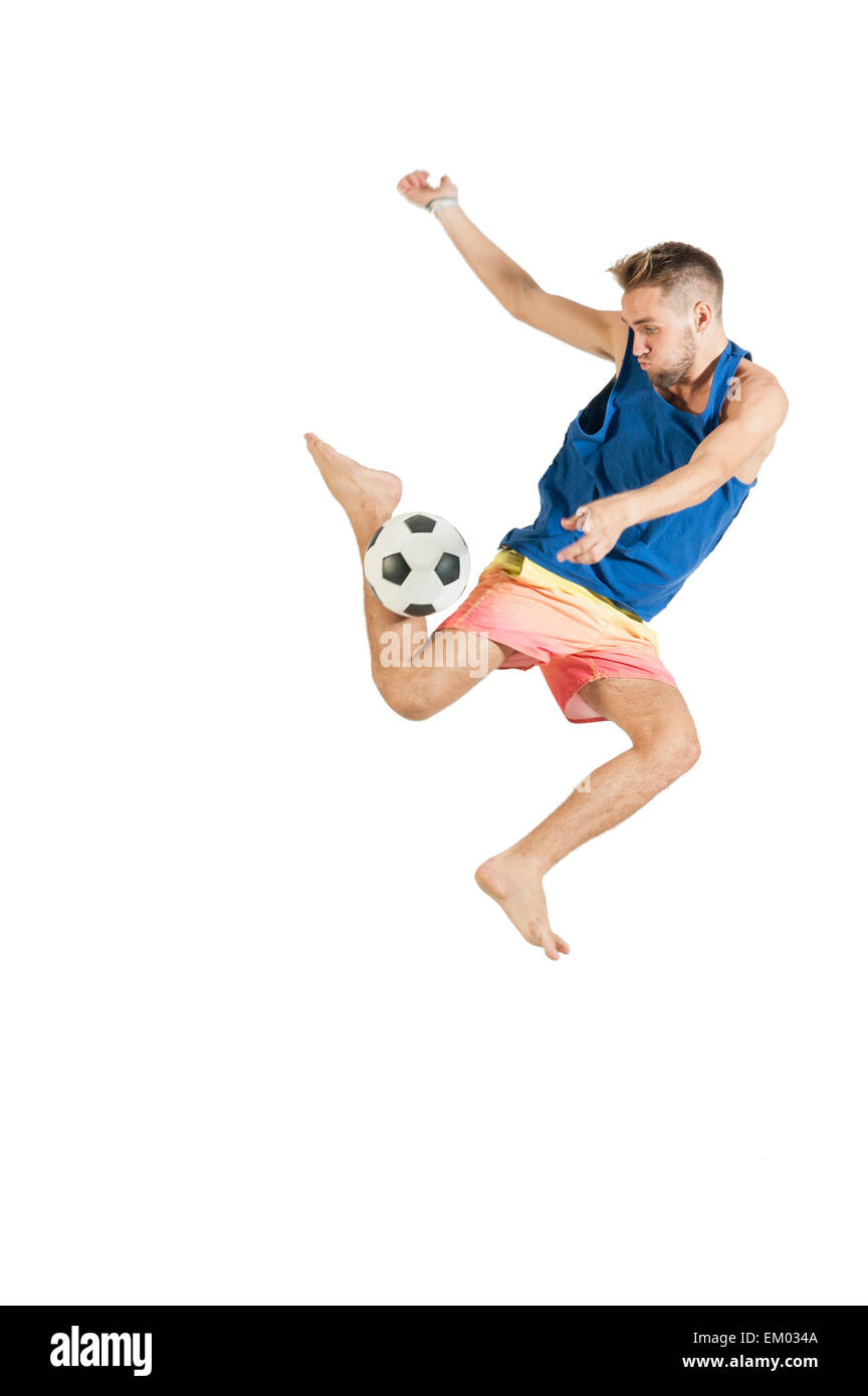 Young attractive guy playing with football on white background Stock ...