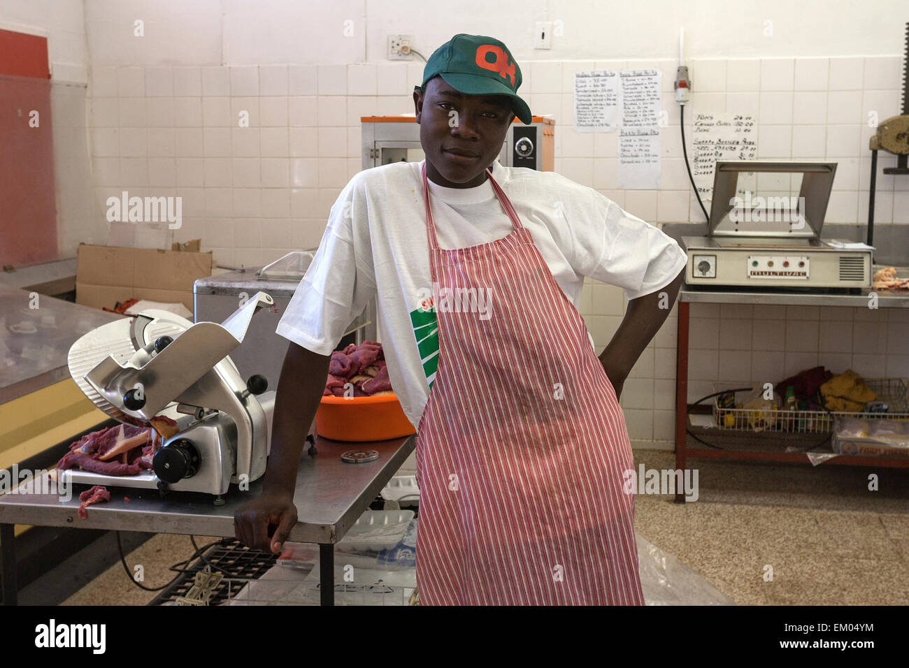 Young Namibian butcher wearing baseball cap, Uis, Namibia Stock Photo ...