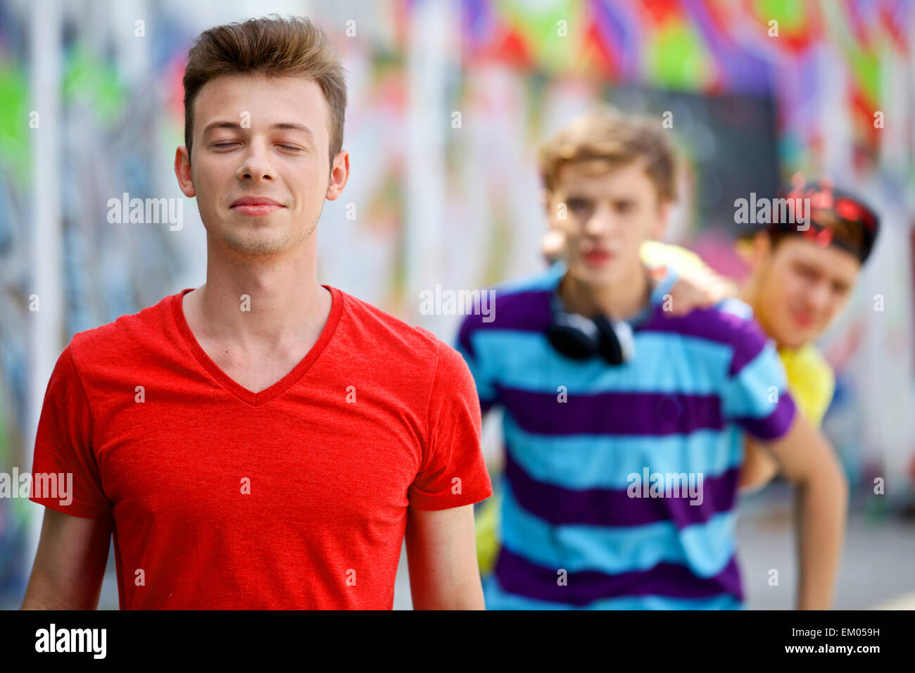 Three young friends happy Stock Photo - Alamy