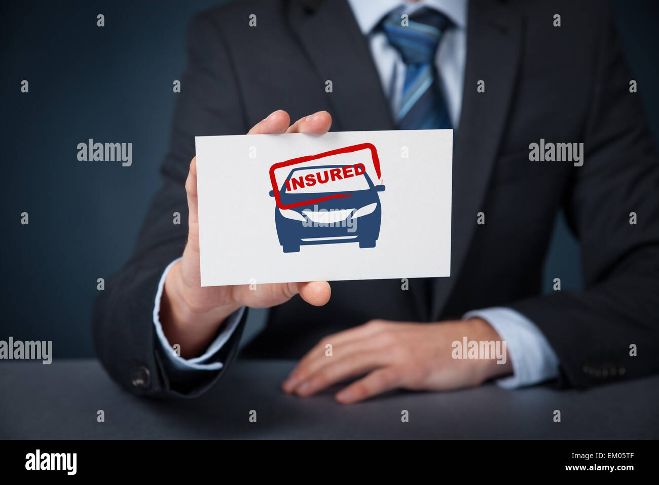 Insured car concept. Insurance agent with car silhouette on card and ...