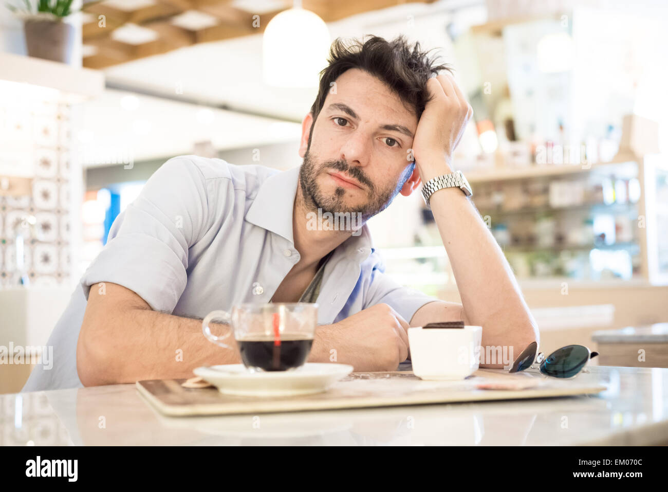 man at the bar drinking coffee Stock Photo - Alamy