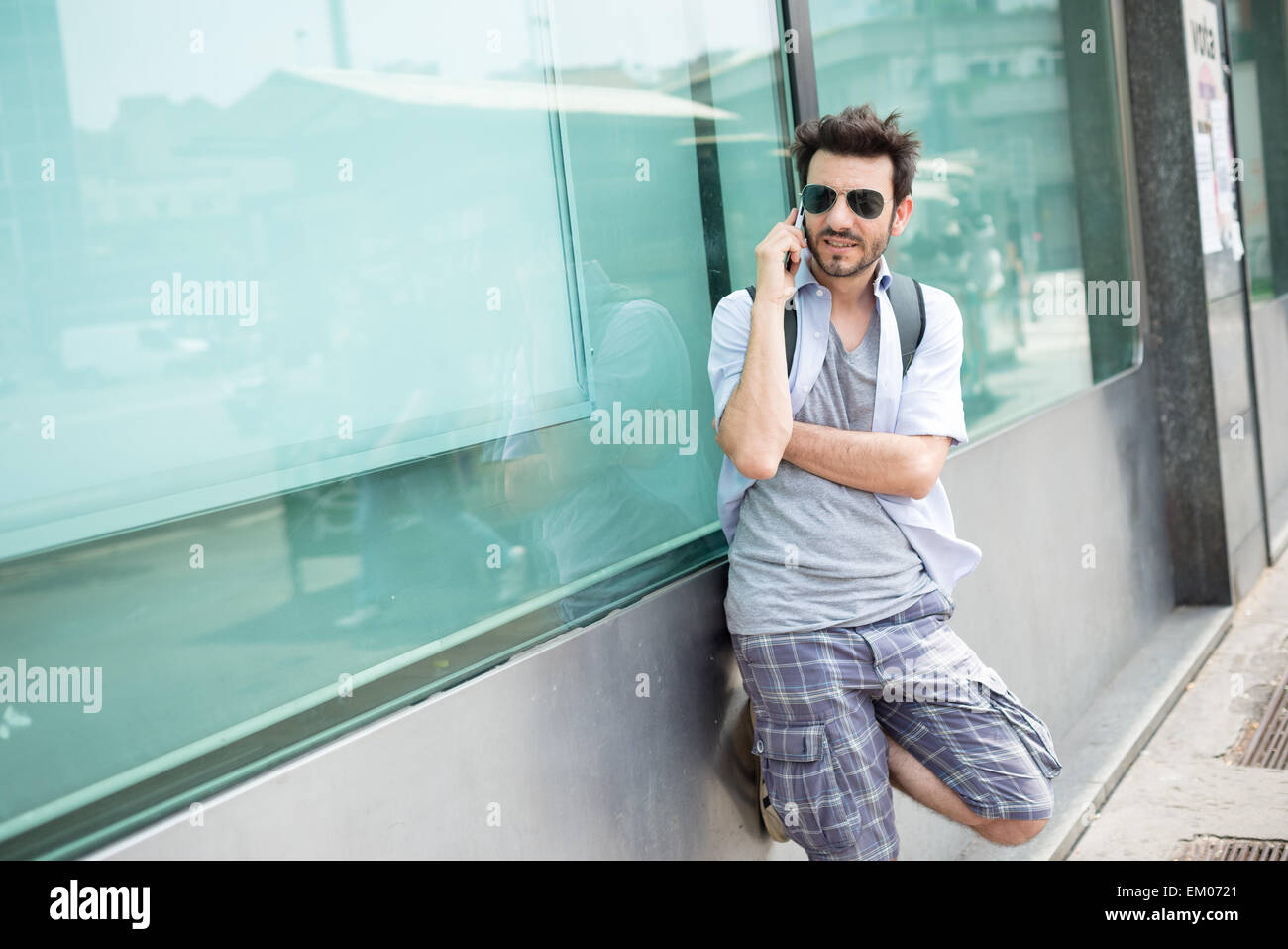 man in the street on the phone Stock Photo - Alamy