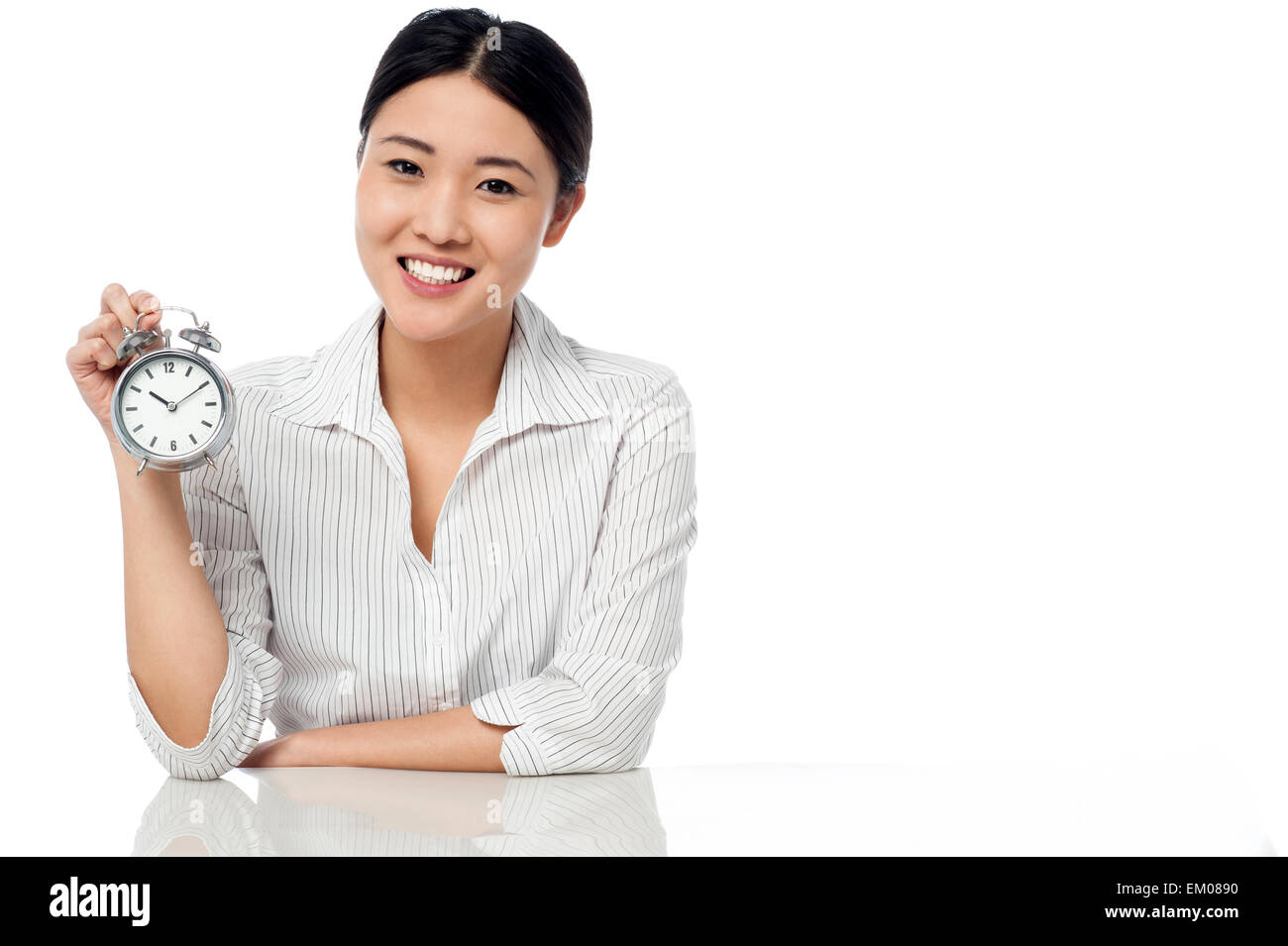 Business lady holding alarm clock Stock Photo - Alamy