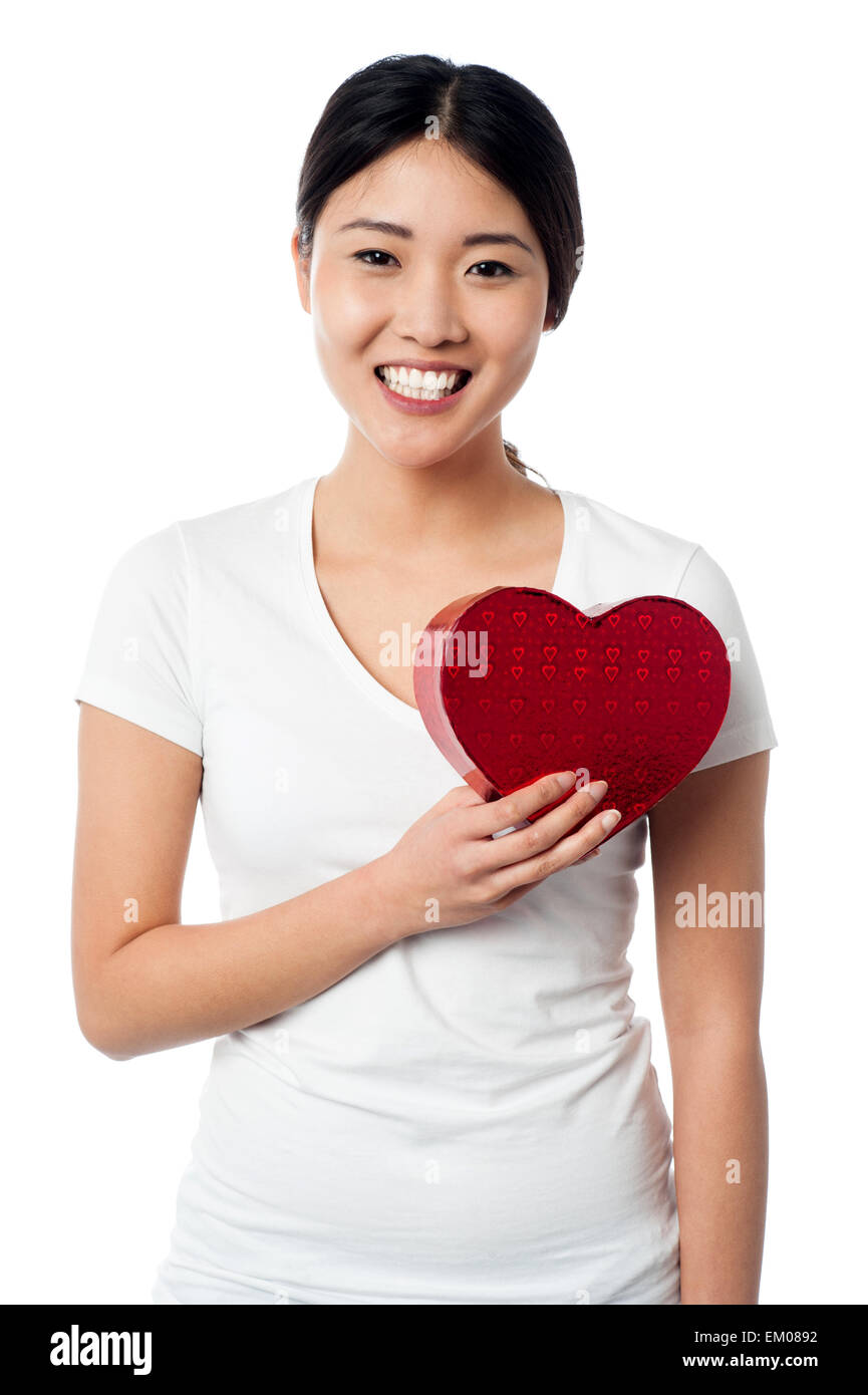 Smiling pretty girl with love heart Stock Photo - Alamy
