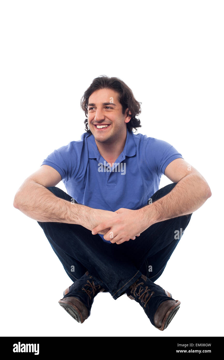 Isolated man sitting on the floor Stock Photo - Alamy