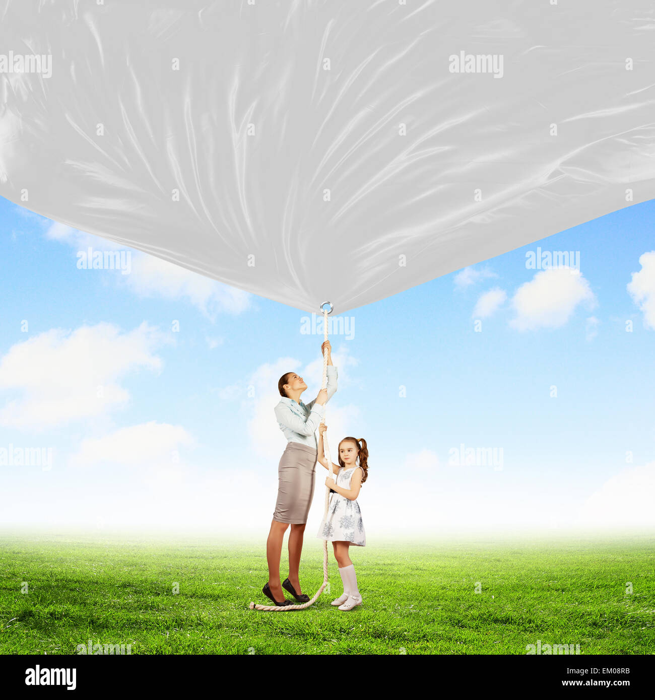 Family pulling banner Stock Photo - Alamy