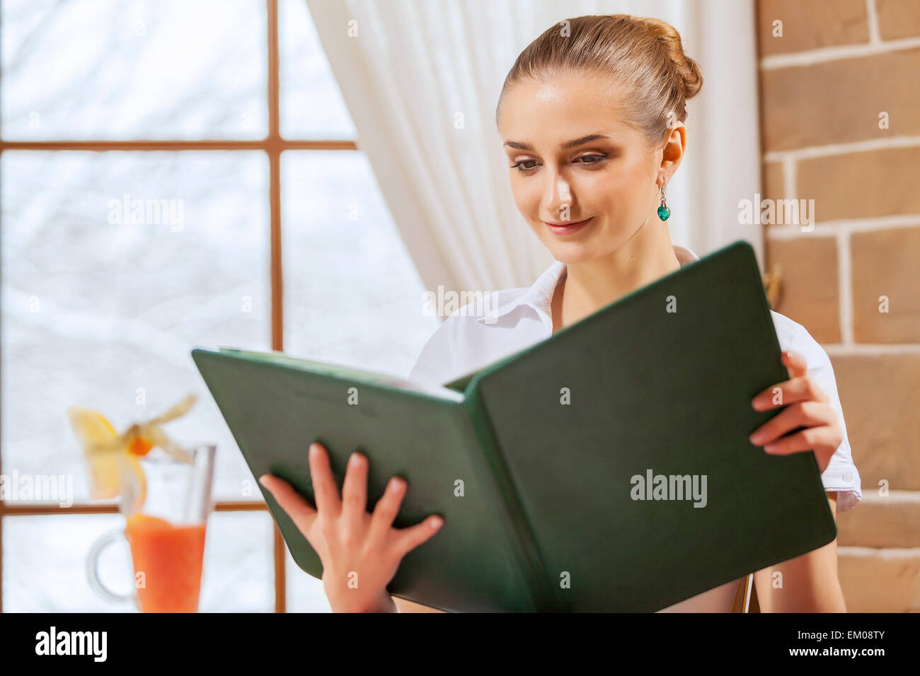 Pretty woman in restaurant Stock Photo - Alamy