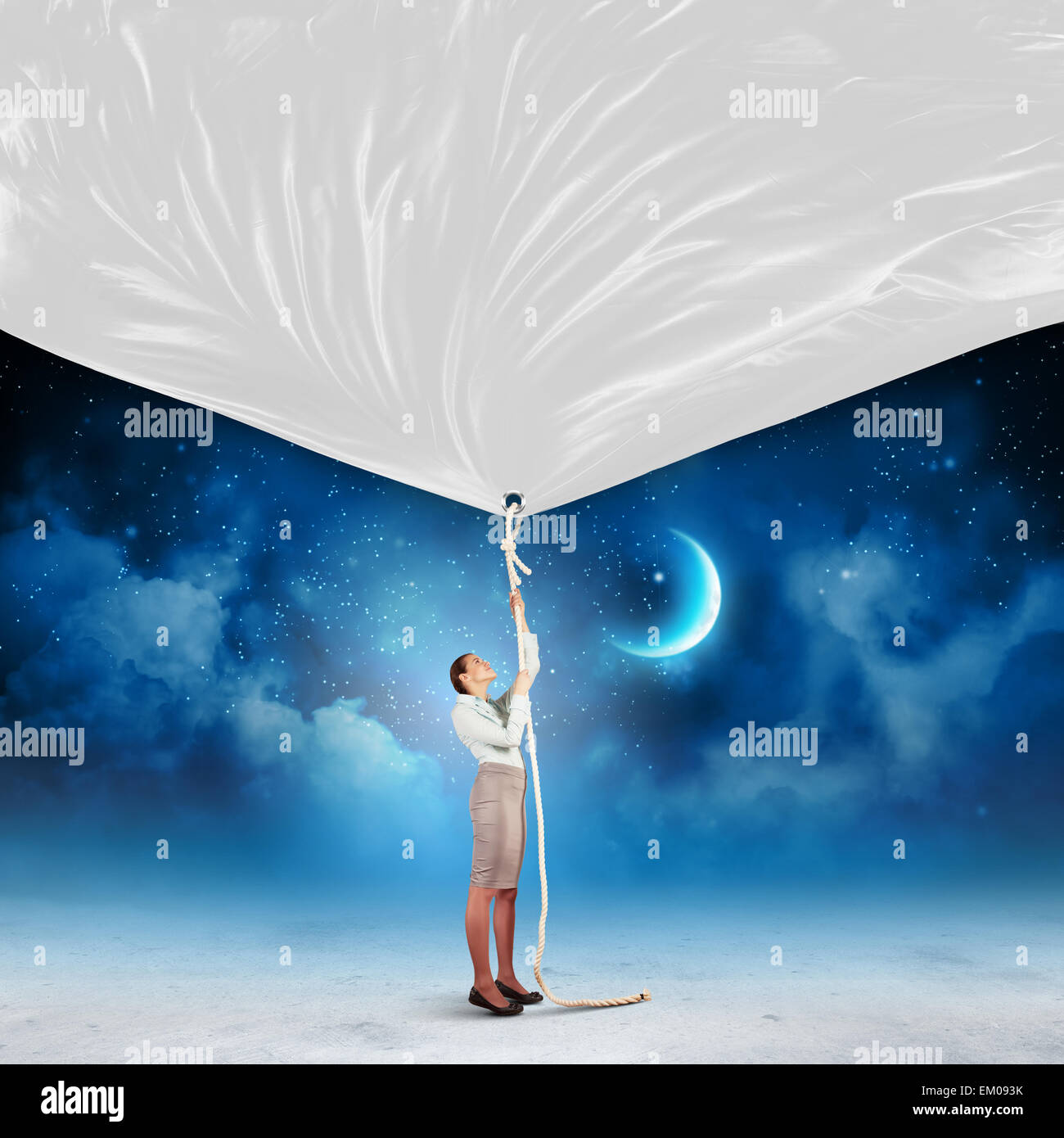 Businesswoman pulling banner Stock Photo - Alamy