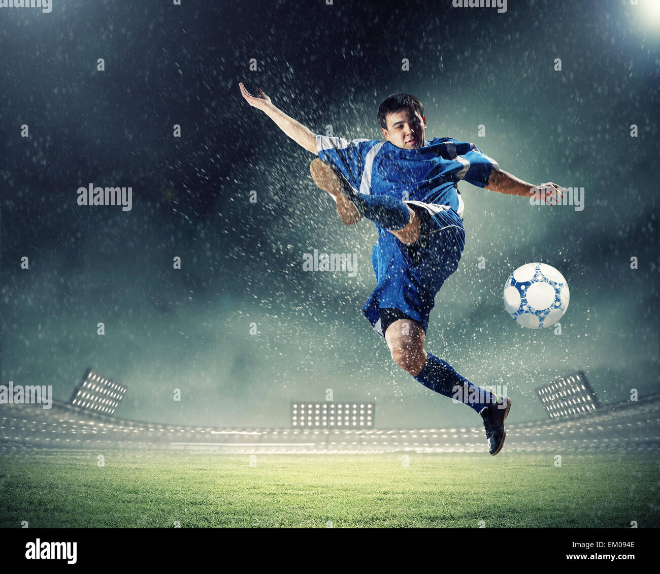 football player striking the ball Stock Photo - Alamy