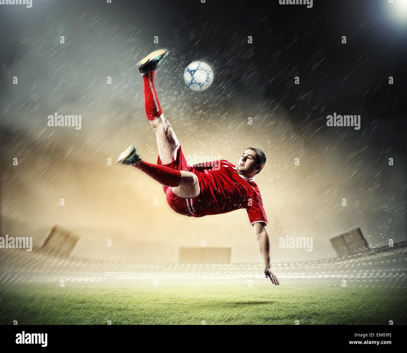 football player striking the ball Stock Photo - Alamy