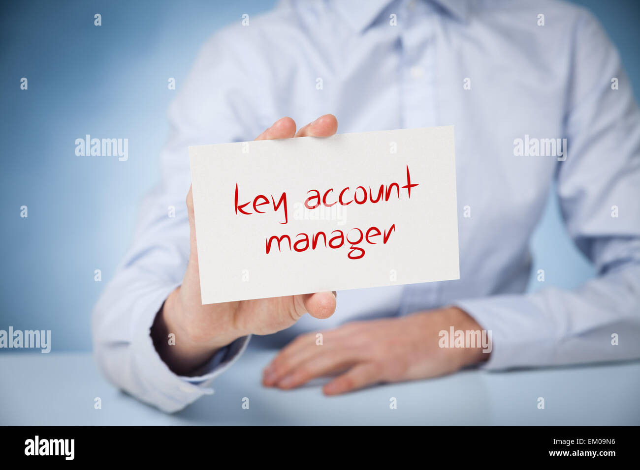 Key account manager advertisement concept. Man show card with text key ...