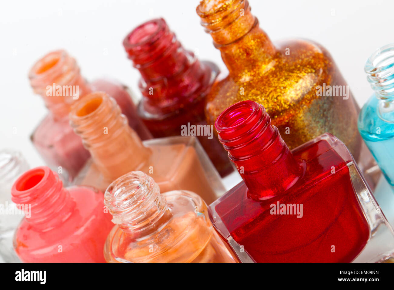 Group of bright nail polishes on white Stock Photo - Alamy
