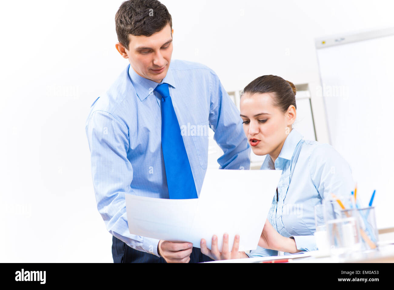 colleagues discuss the reports Stock Photo - Alamy