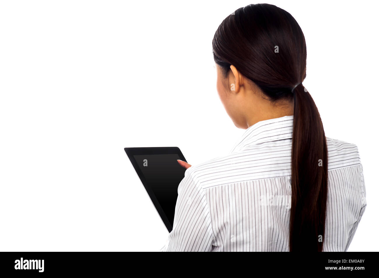 Back pose of a woman operating touch pad device Stock Photo - Alamy