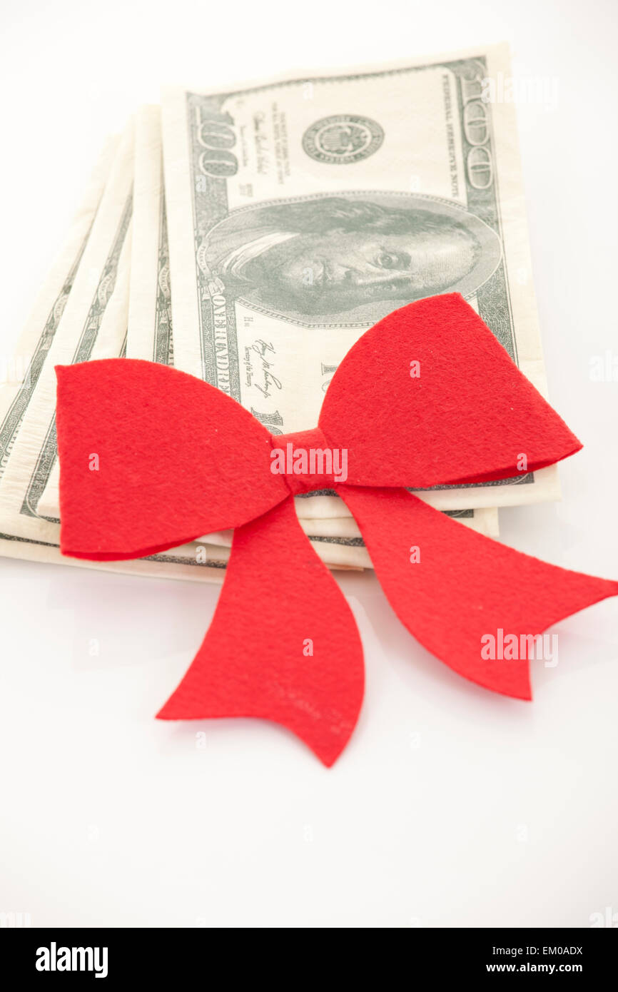 Money, gift wrapped in red bow and ribbon, one hundred dollars b Stock ...