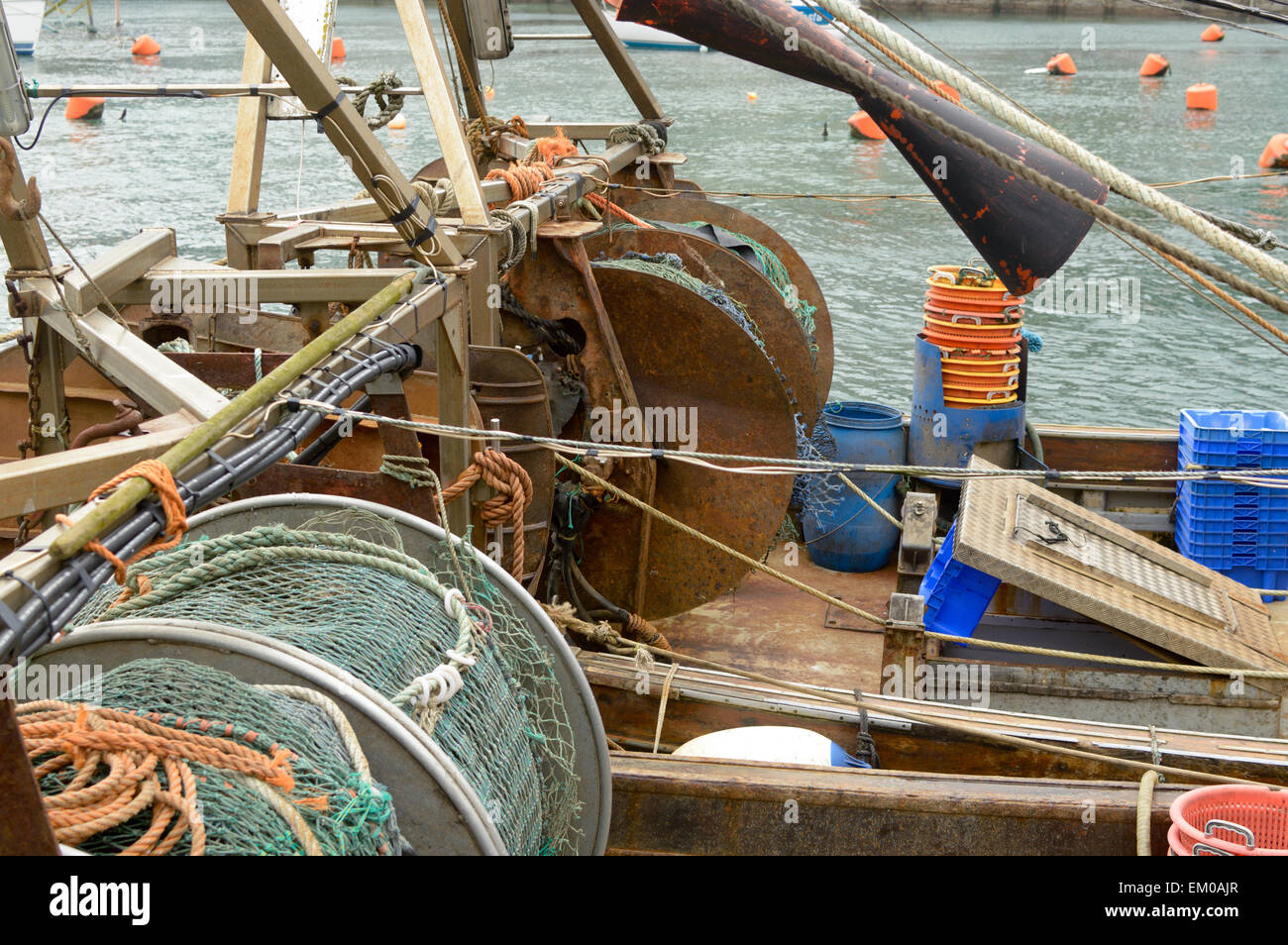 Fishing net and winding mechanism on trawler boat moored in Looe ...