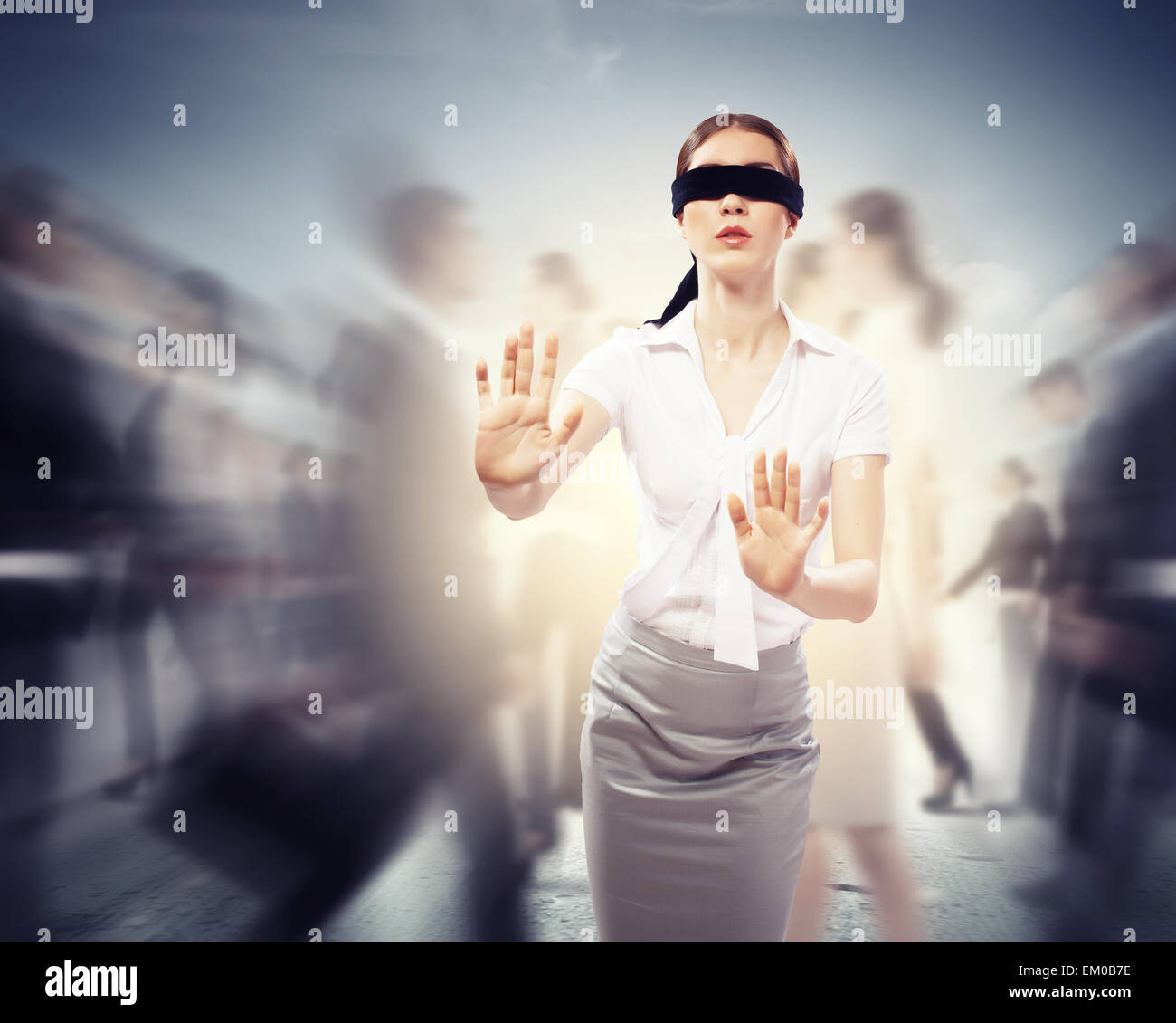 Businesswoman in blindfold among group of people Stock Photo - Alamy