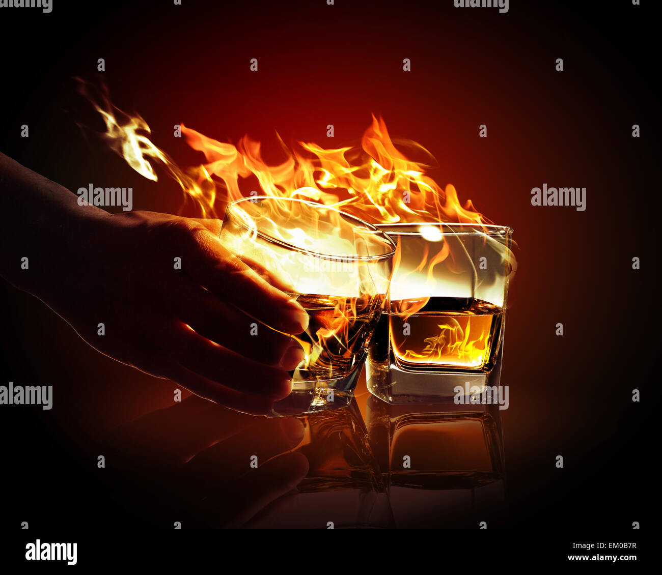 Two glasses of burning yellow absinthe Stock Photo - Alamy