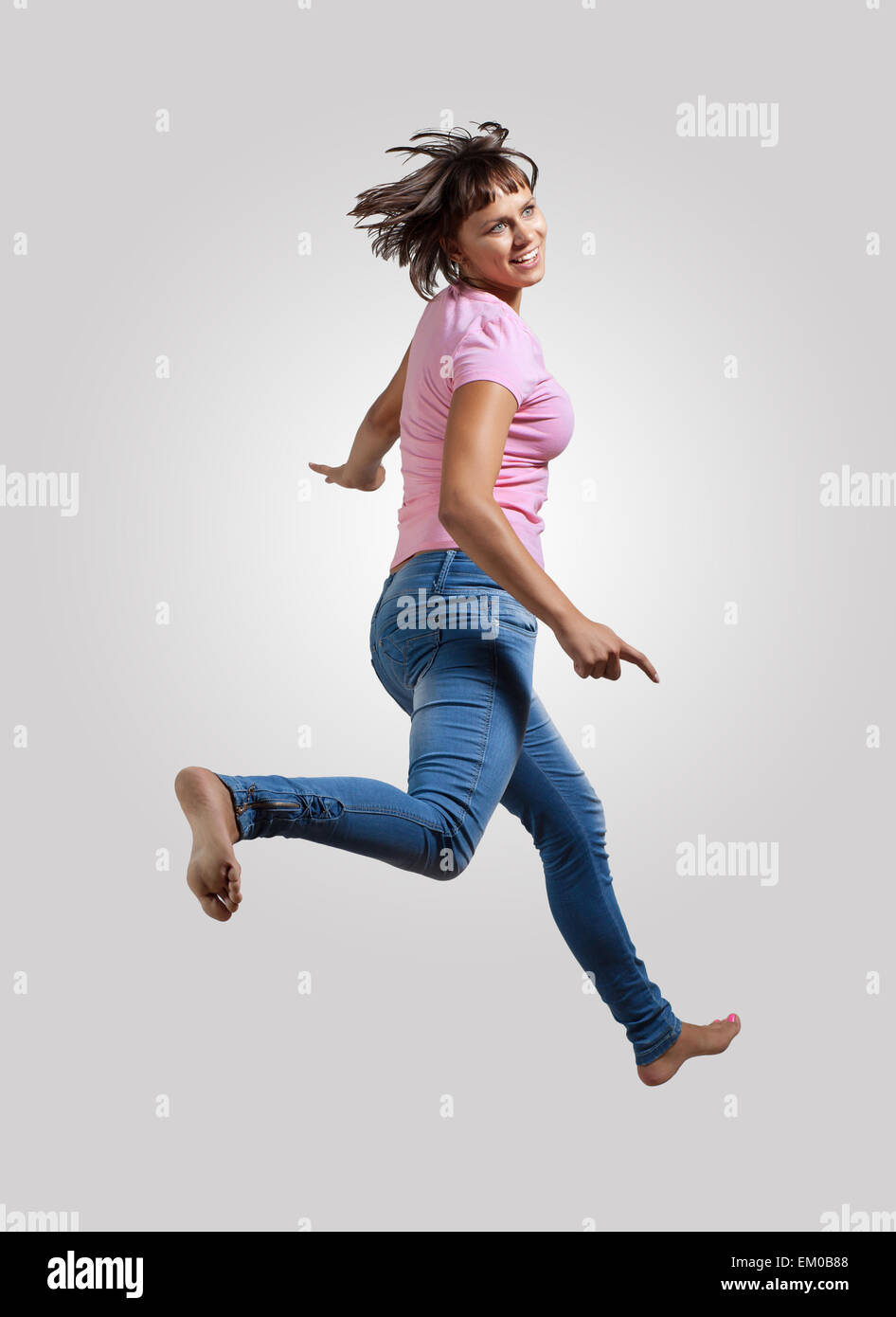 young woman dancing and jumping Stock Photo - Alamy