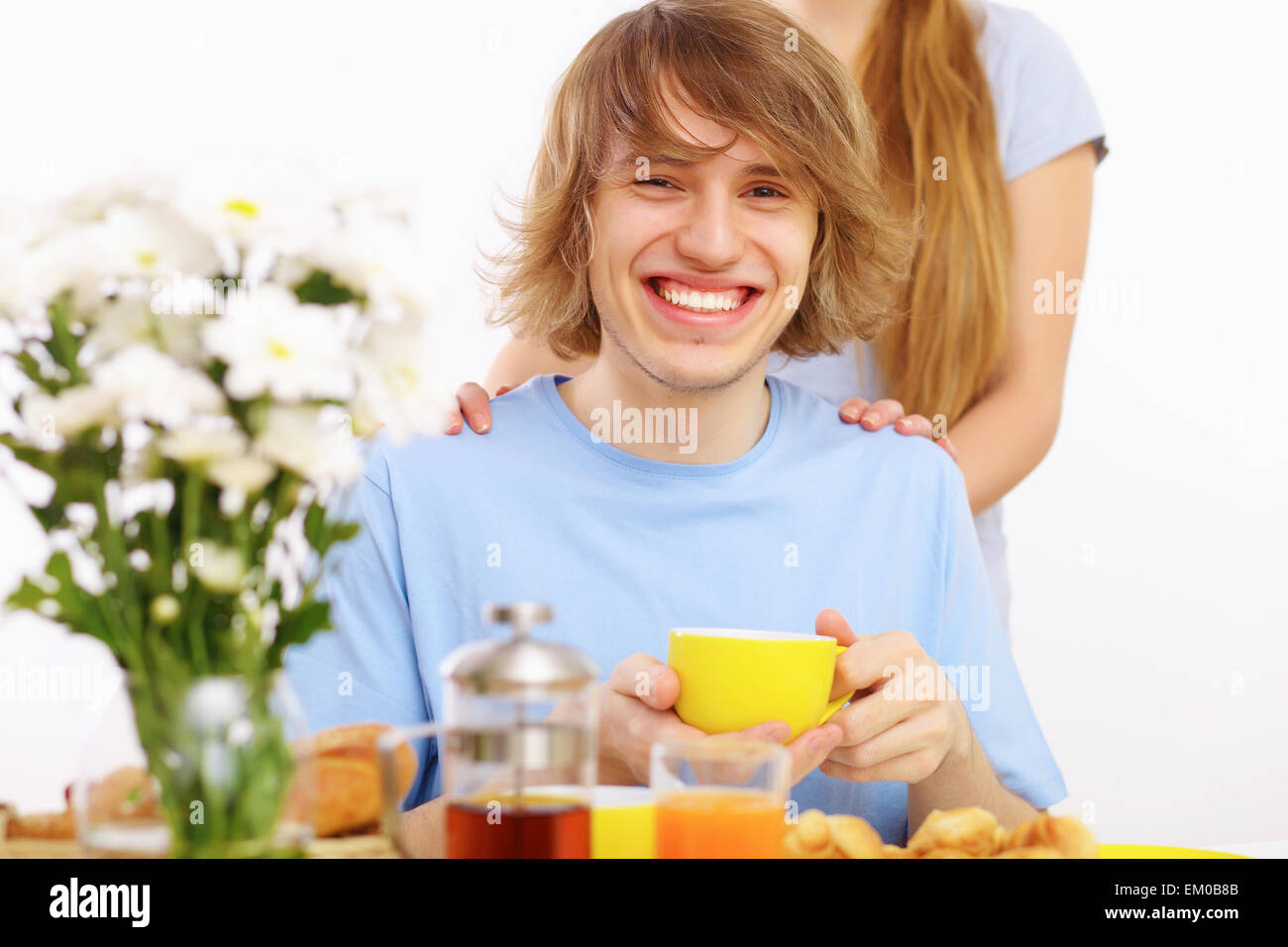 Young happy man drinking tea Stock Photo - Alamy Young happy man drinking tea Stock Photo - Alamy