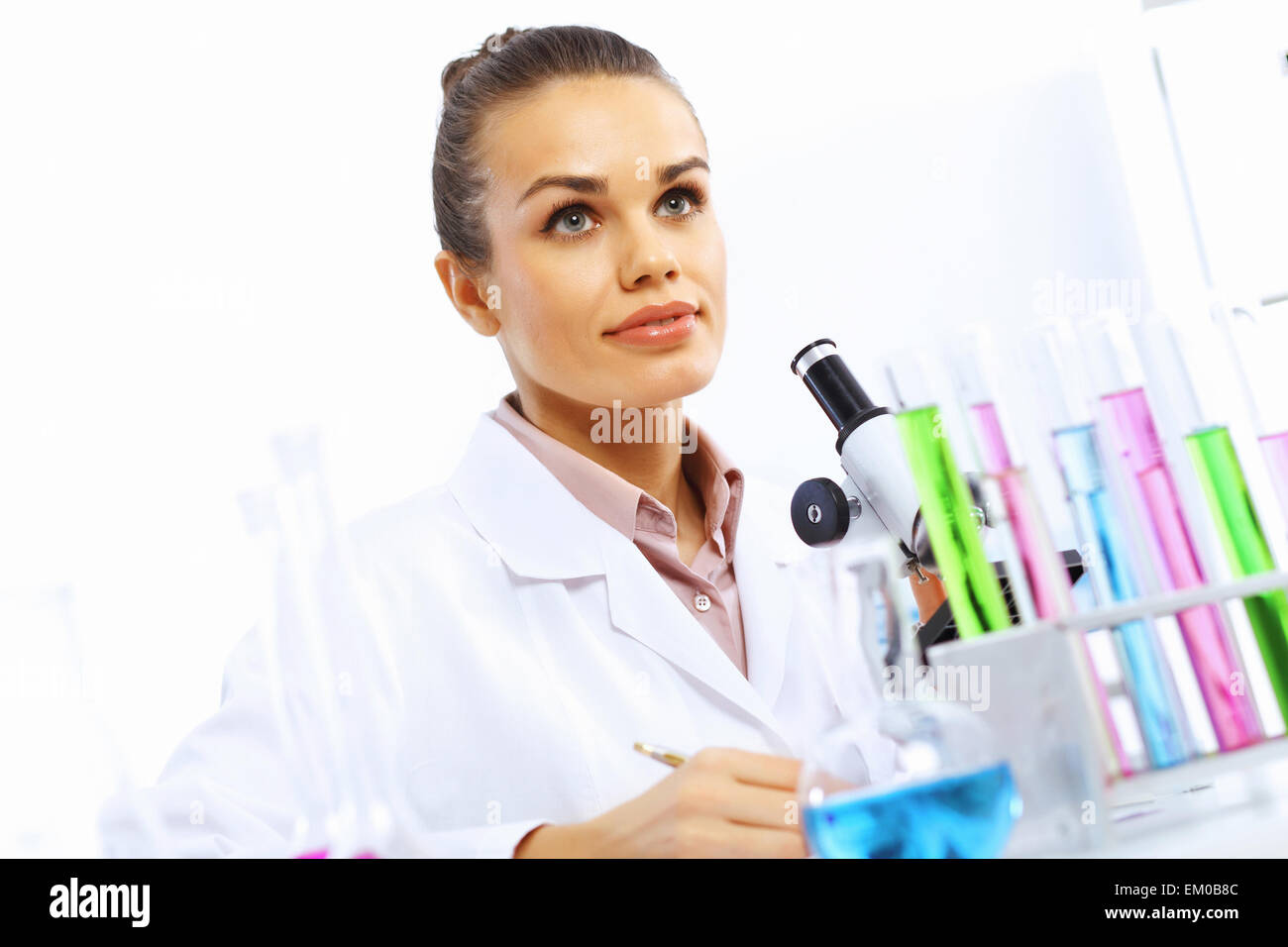 Young female scientist working in laboratory Stock Photo - Alamy