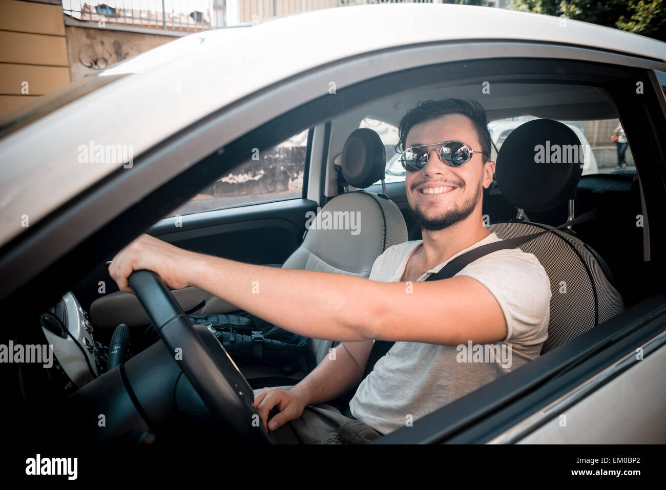 stylish man driving car Stock Photo - Alamy
