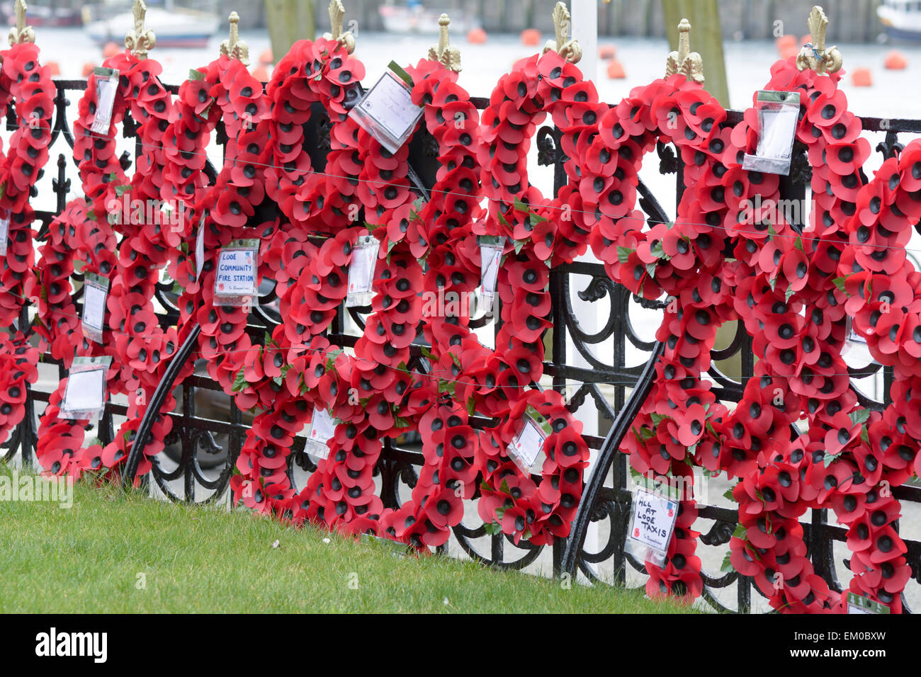 Poppy ring wreaths at Looe War Memorial, Cornwall, England Stock Photo ...