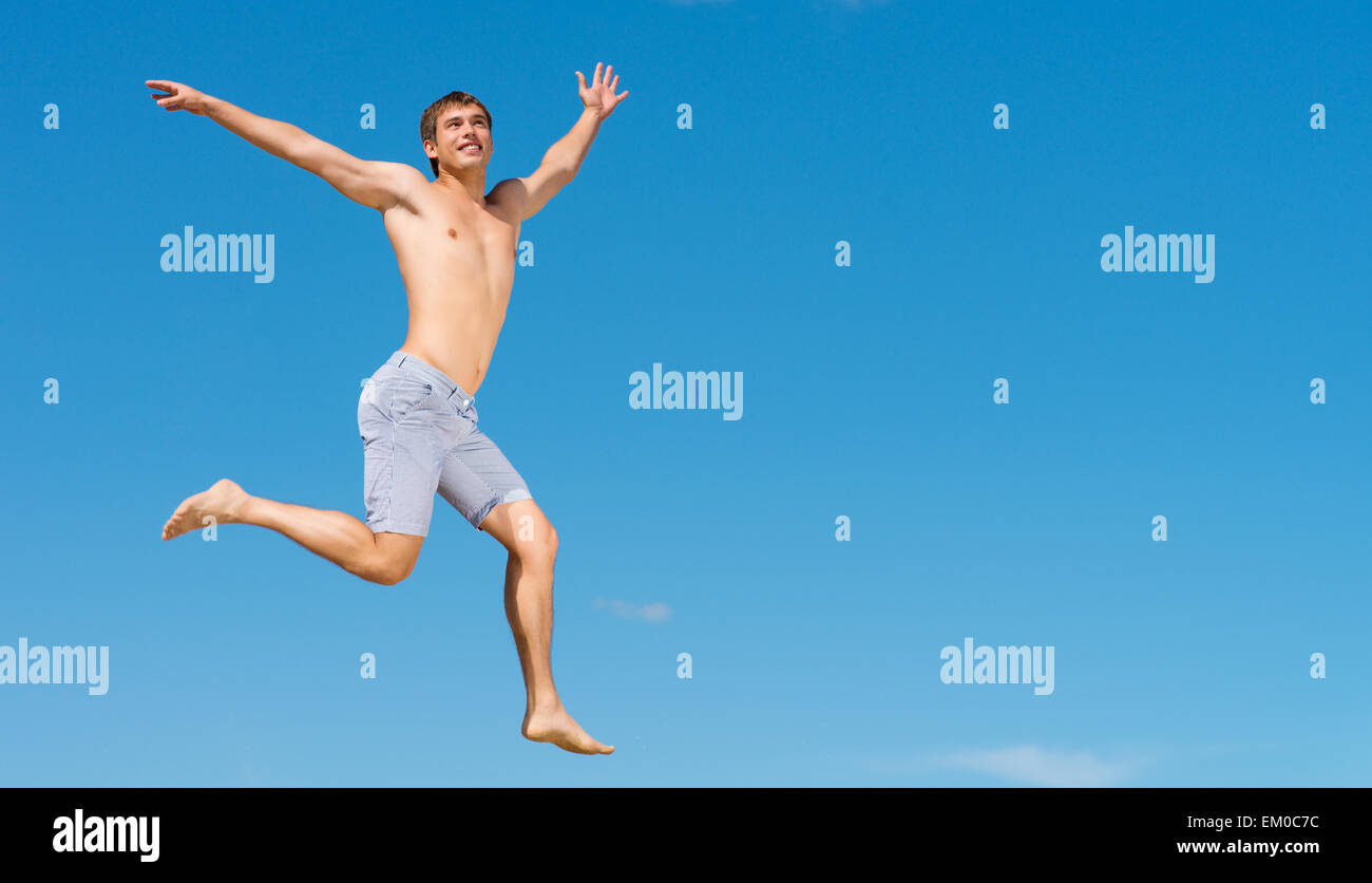 young man jumping Stock Photo - Alamy