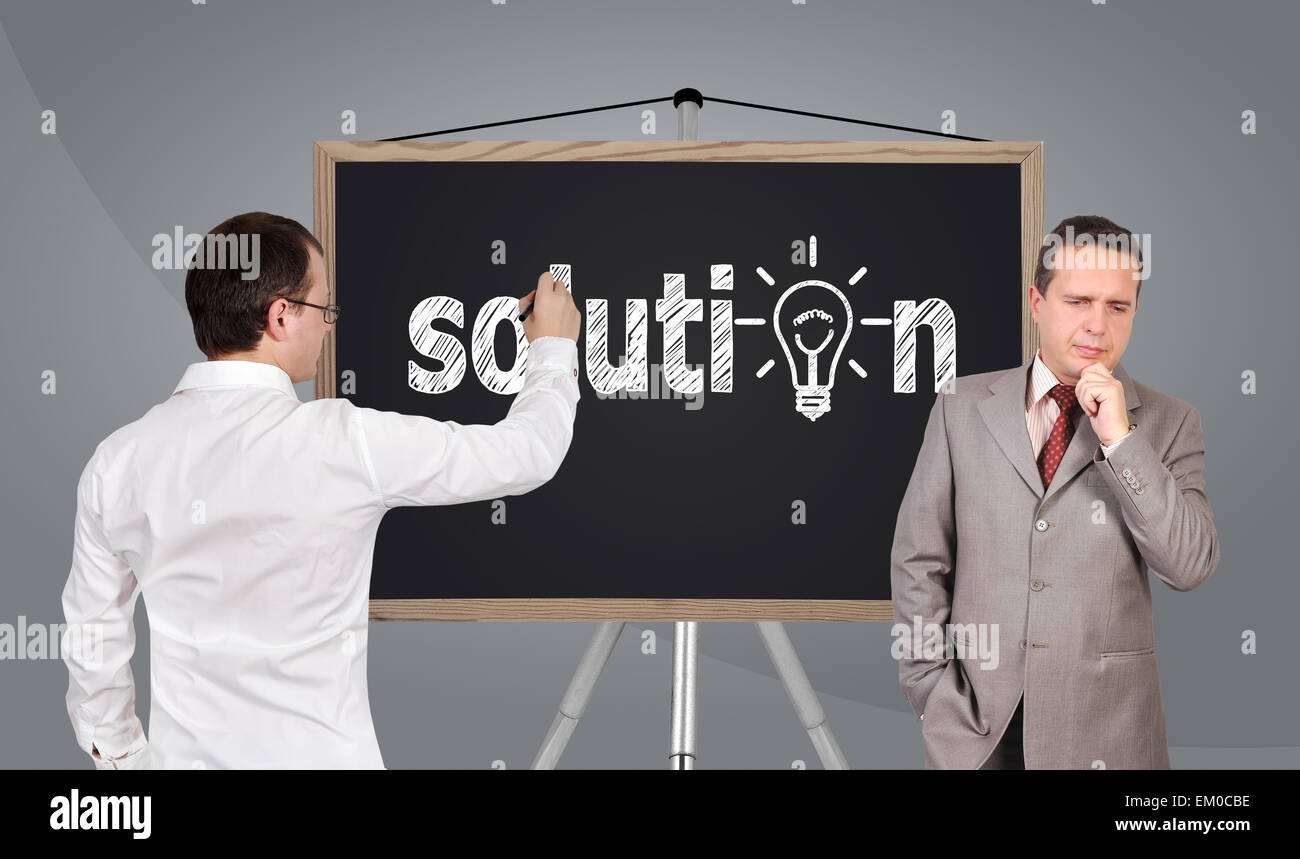 drawing solution on blackboard Stock Photo - Alamy