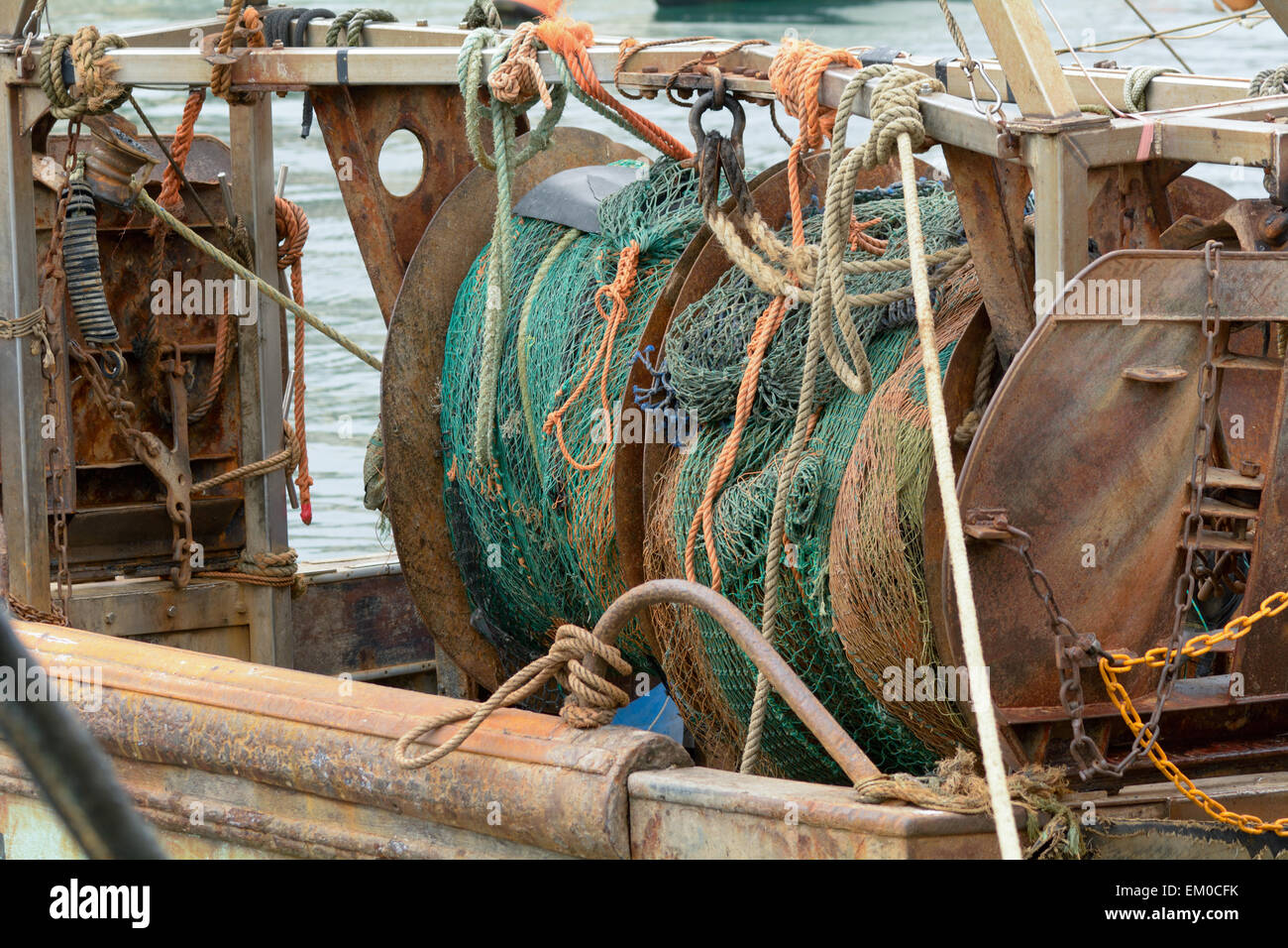 Fishing net and winding mechanism on trawler boat moored in Looe ...