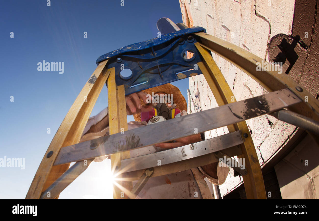 Graffiti Artist Framed By Ladder Stock Photo - Alamy