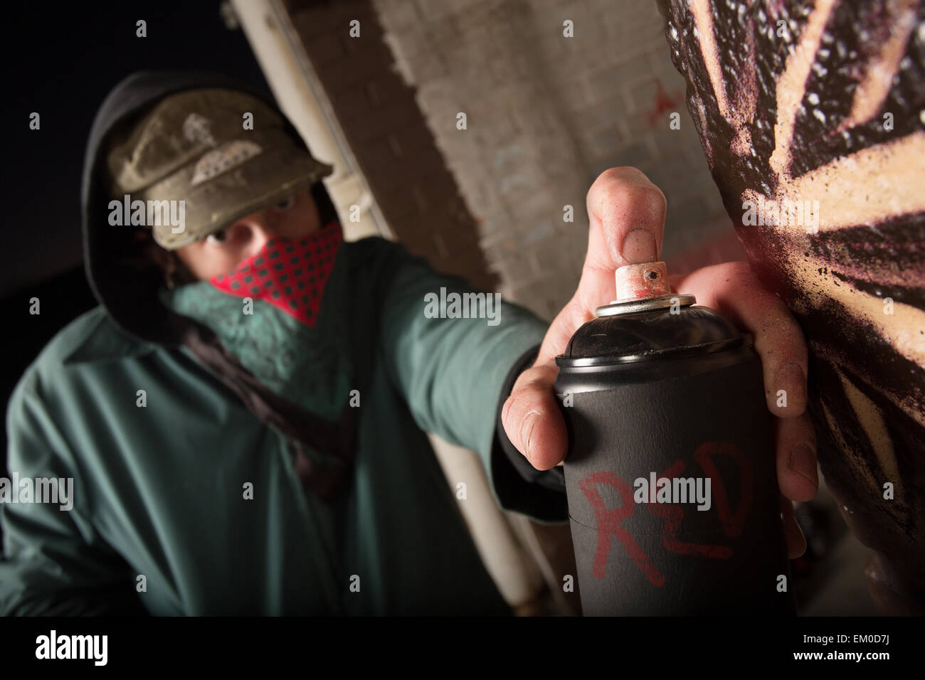 Criminal Holding Up Spray Can Stock Photo - Alamy