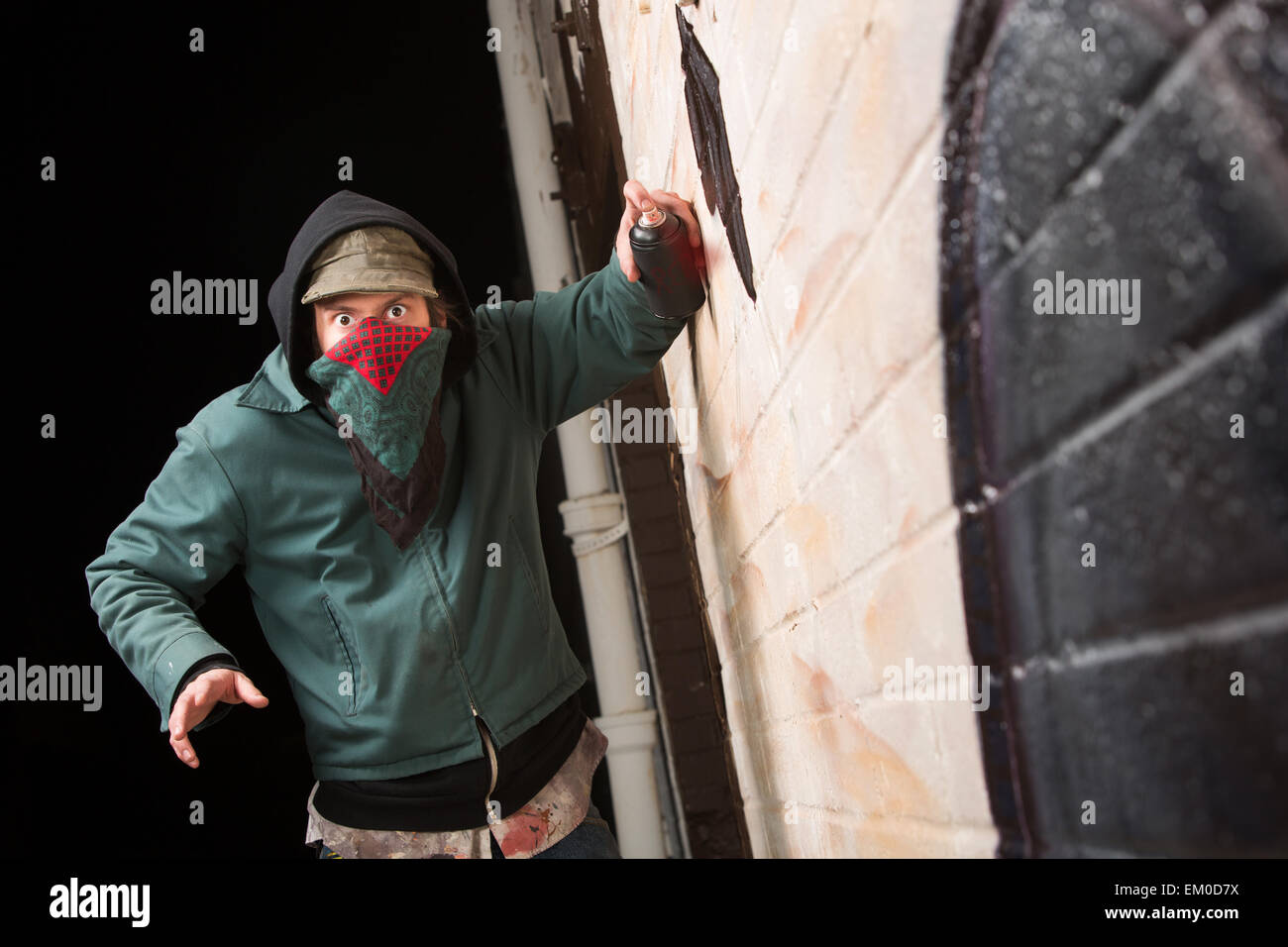 Scared Gangster with Spray Paint Stock Photo - Alamy