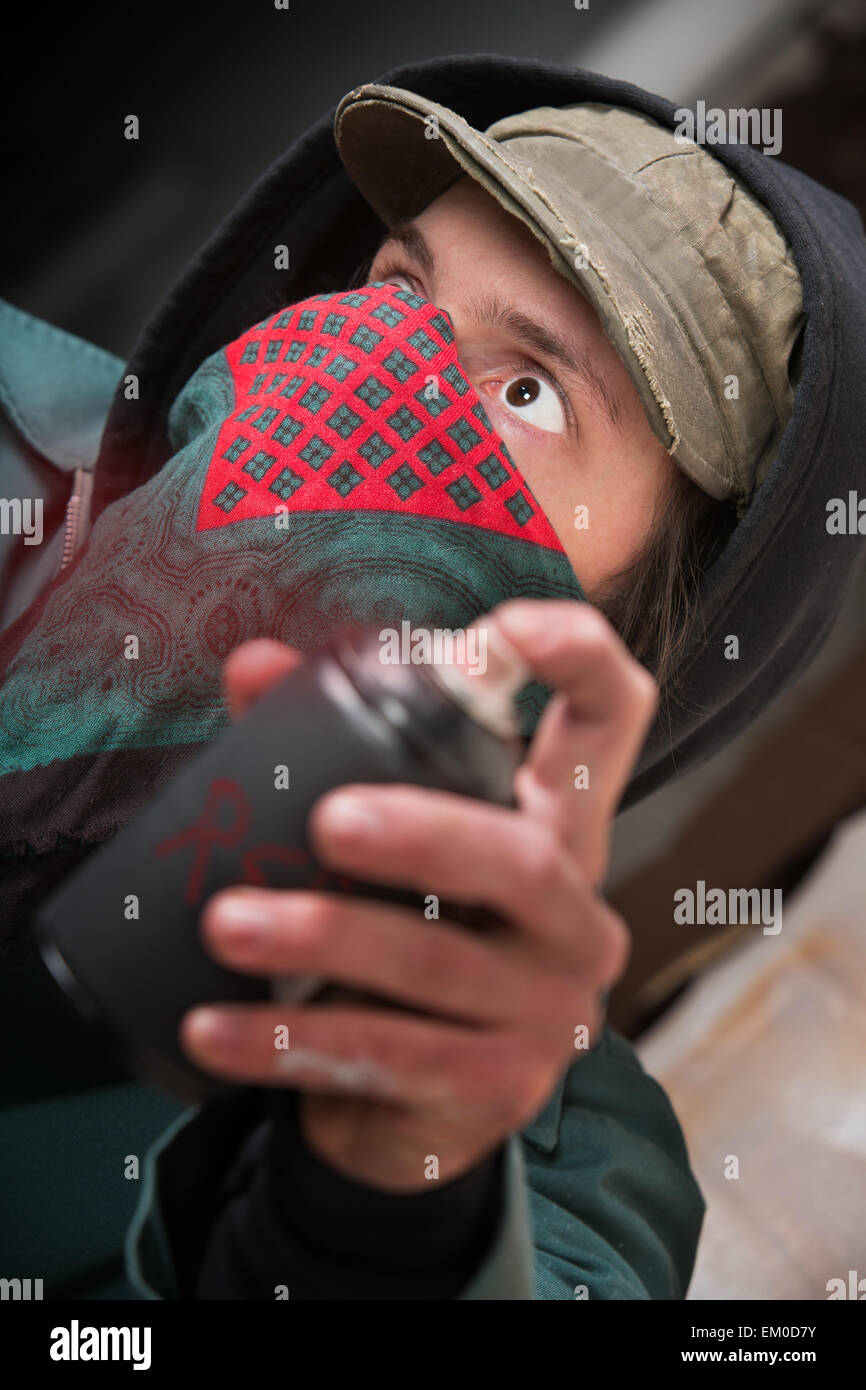 Scared Criminal with Spray Paint Stock Photo - Alamy