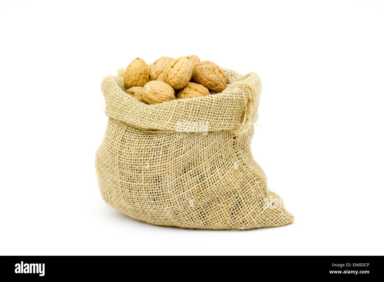 Burlap sack full of whole walnuts Stock Photo - Alamy
