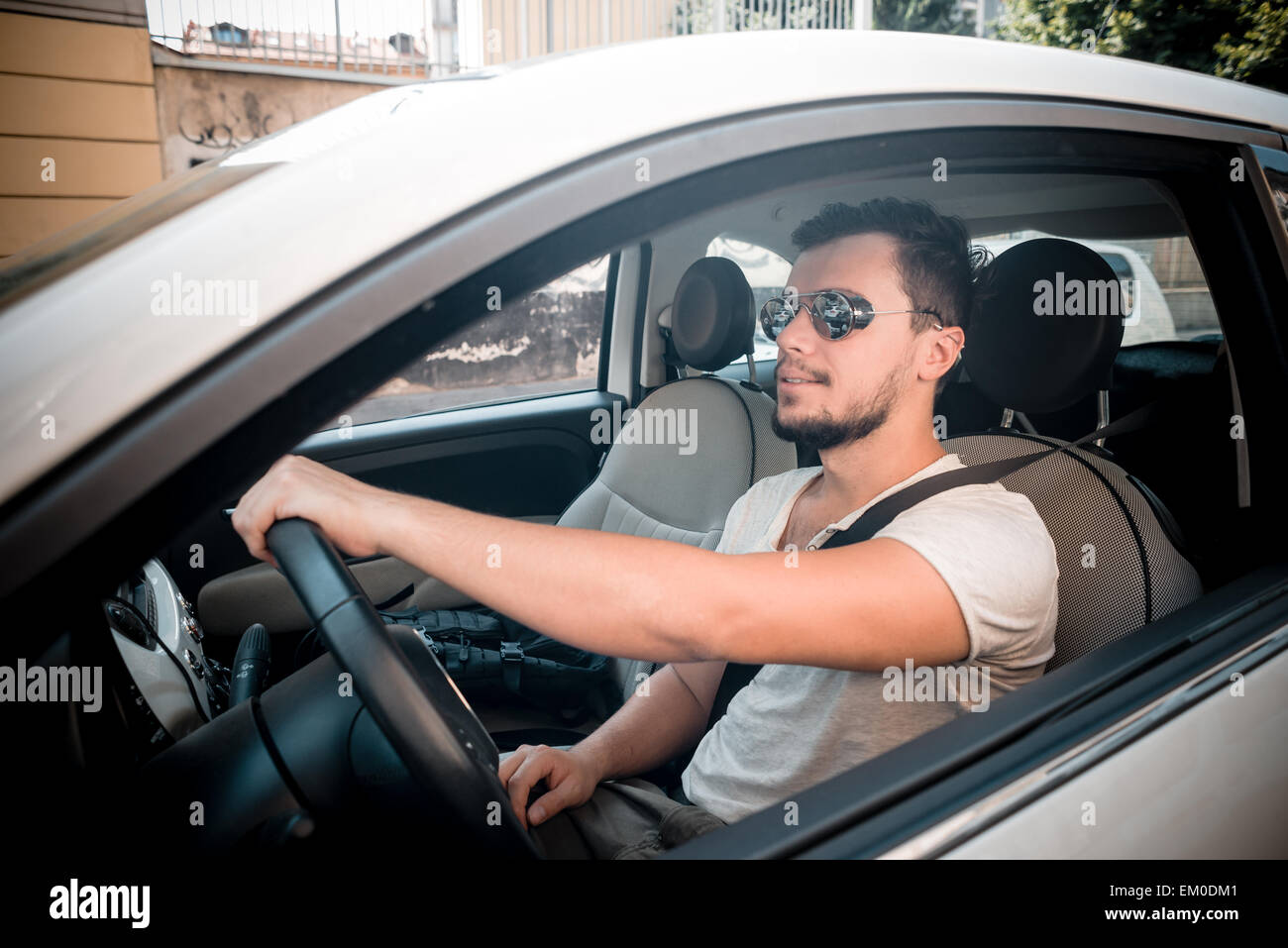 stylish man driving car Stock Photo - Alamy