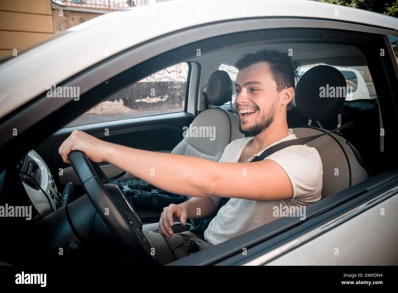 stylish man driving car Stock Photo - Alamy