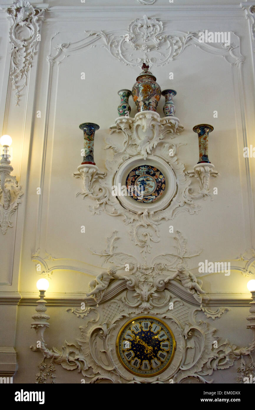 Wall clock in the imperial palace. St. Petersburg. Russia Stock Photo ...